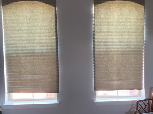 Tall arched windows in bedroom