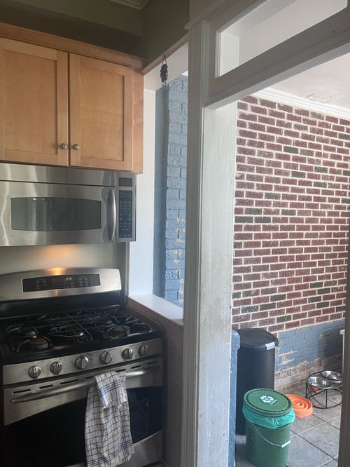 Range in corner end of kitchen and ideas for wall needed.