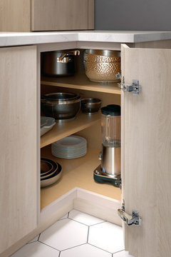 Angled base corner cabinets in U shaped kitchen