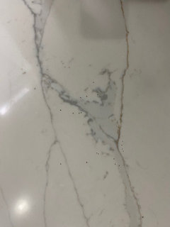 weird blemishes and cloudy areas on quartz countertop