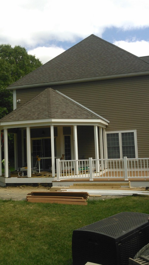 Octagon shape, turret style roof, screened porch.