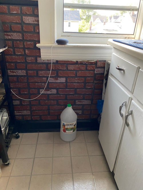 How can I extend a counter and cabinet across this window?