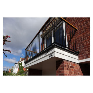 Front exterior - garage door, hand rail, and railing in West Wimbledon ...