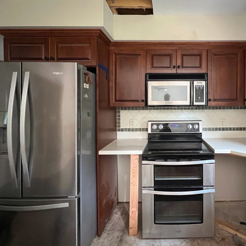 Soffit with crown moulding - window and hood.