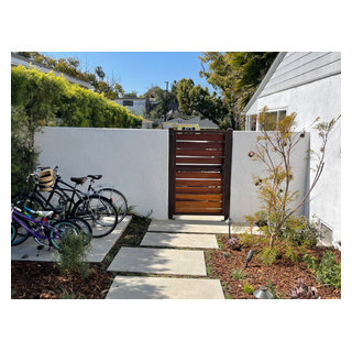 New wall, repurposed gate. We love to salvage when possible ...