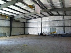 Turning a metal building into a loft style house with shop