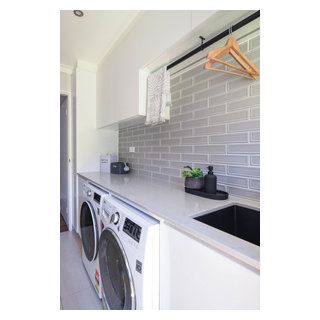 Laundry with hanging rails and subway tiles - Modern - Laundry Room ...