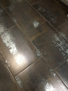 Bad tile installation or warped/bent tiles?