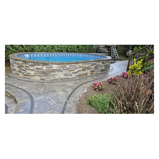 Above Ground Pool Wrapped with Stone Veneer and Cambridge Paver Patio ...