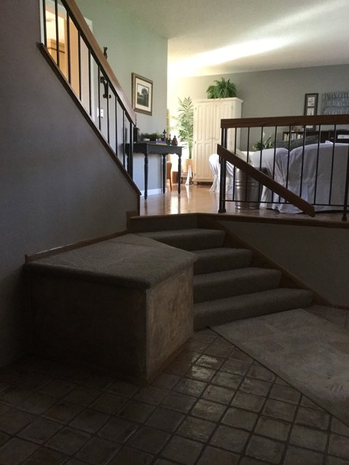 Redesign stairs to eliminate awkward landing in entry.