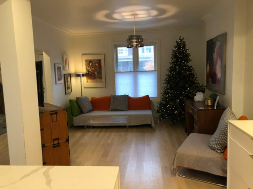 Living room with angled wall layout