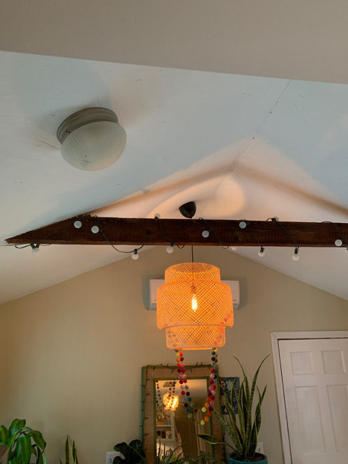 awkward light fixture on sloped ceiling