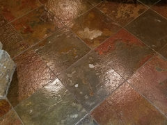 Older slate tile flaking (in kitchen)