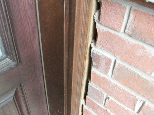 How do we finish the outside cladding around the front door?