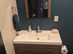 bathroom vanity against the side wall or 2" gap?