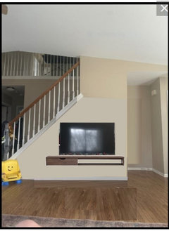 Help! Should I add a fireplace in front of my stairs in living room?