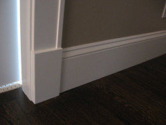 Baseboard is wider than door casing