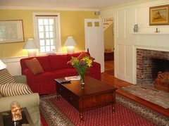 How do I use a red traditional sofa in a neutral room?