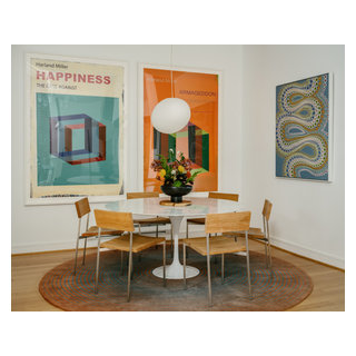 White Loft Dining Room with Round Table, Wood Chairs + Modern Art ...