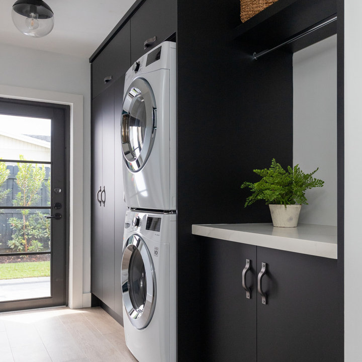 75 Beautiful Utility Room with a Stacked Washer and Dryer Ideas and ...