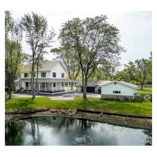 Luxury Lakefront Farmhouse with Wrap-Around Porch & Fountain Views ...