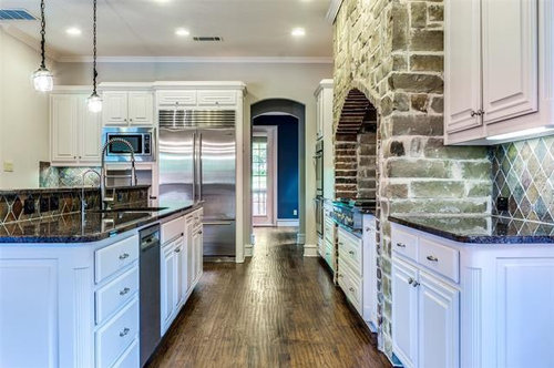 How to modernize a kitchen with stone arch over stove?