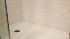 Why are my shower tiles becoming discolored?