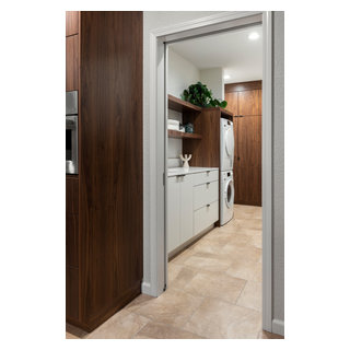 Laundry Room with Walnut and White Cabinetry Off of Kitchen ...