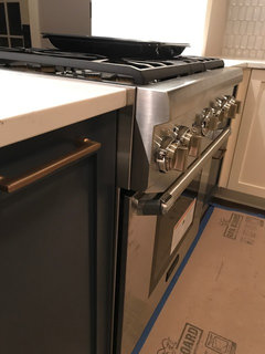 How flush should my thermador range be to front of cabinets/counter?