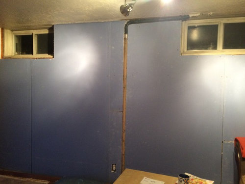 Covering pipe on wall