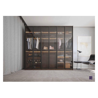 Linear glass wardrobe in dark wood chest drawers supplied by Inspired ...