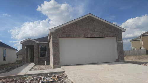 This is a new construction home, The brick color is Silver Ridge by A