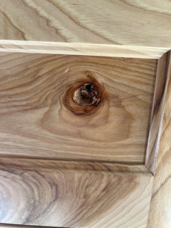 Why did my cabinet maker fill the knots in my hickory with wood filler