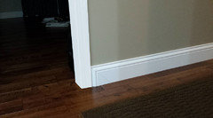 Baseboard is wider than door casing