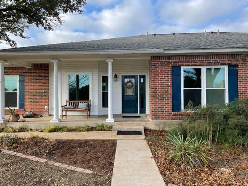 Red brick ranch-style home - getting new columns, shutters and door