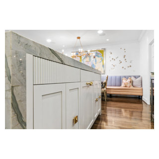 Elegant Eclectic Home Bar with Marble Island and Luxe Metallic Accents ...