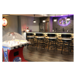 Lower Level Bar With Whiskey Barrel Planks, Gray Cabinets, and Black ...