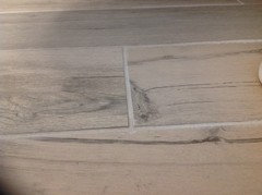 Help! Sharp edges on floor tiles after install.