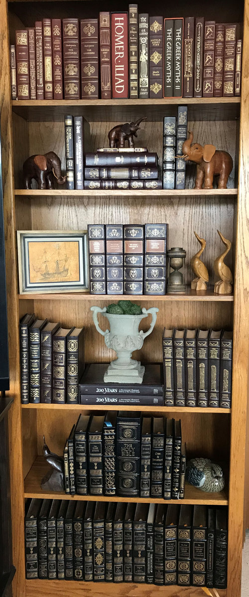 Help me curate these 2 bookshelves in my living room.