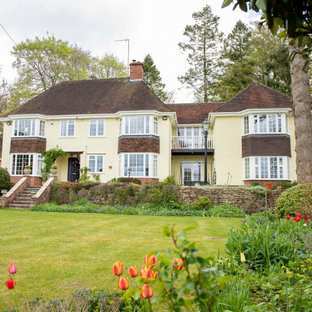 75 Beautiful Yellow Exterior Home with a Brown Roof Pictures & Ideas ...