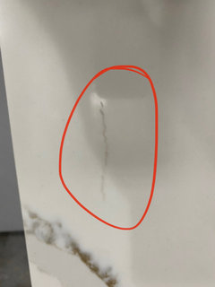 weird blemishes and cloudy areas on quartz countertop