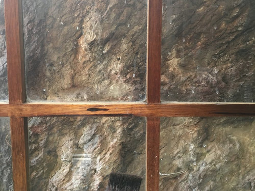 How to accentuate this amazing giant rock outside our kitchen window?