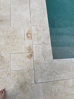 HELP!! Mystery stains on new marble pool deck