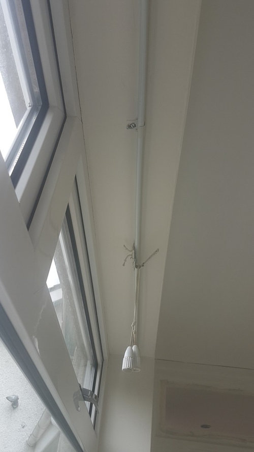Large window at end of narrow hallway... roman blind or curtains ...