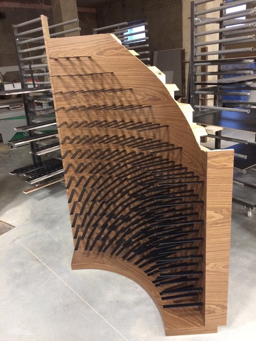 Curved Wine rack with metal strips.