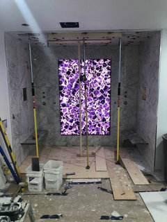 Placing a backlit onyx slab in shower wall