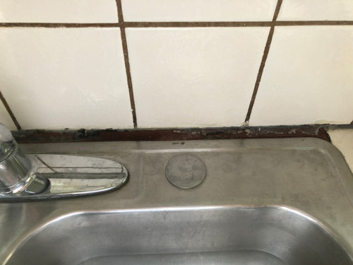 Grout Cracking and Crumbling Behind Kitchen Sink
