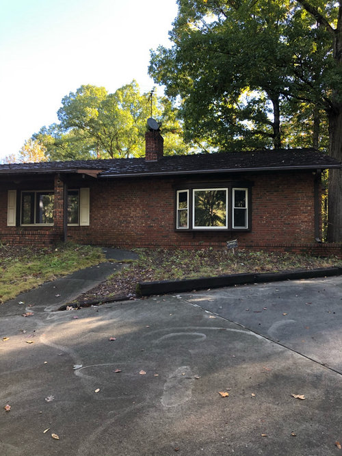 This poor sad looking house needs help.