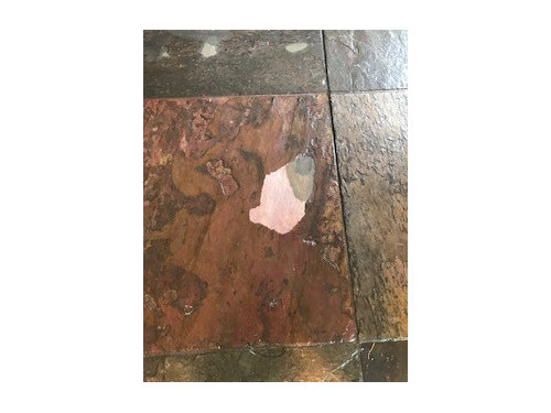 Older slate tile flaking (in kitchen)