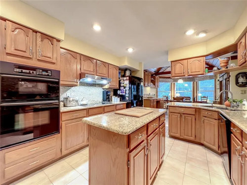 LVP Flooring with Honey Oak Kitchen Cabinets